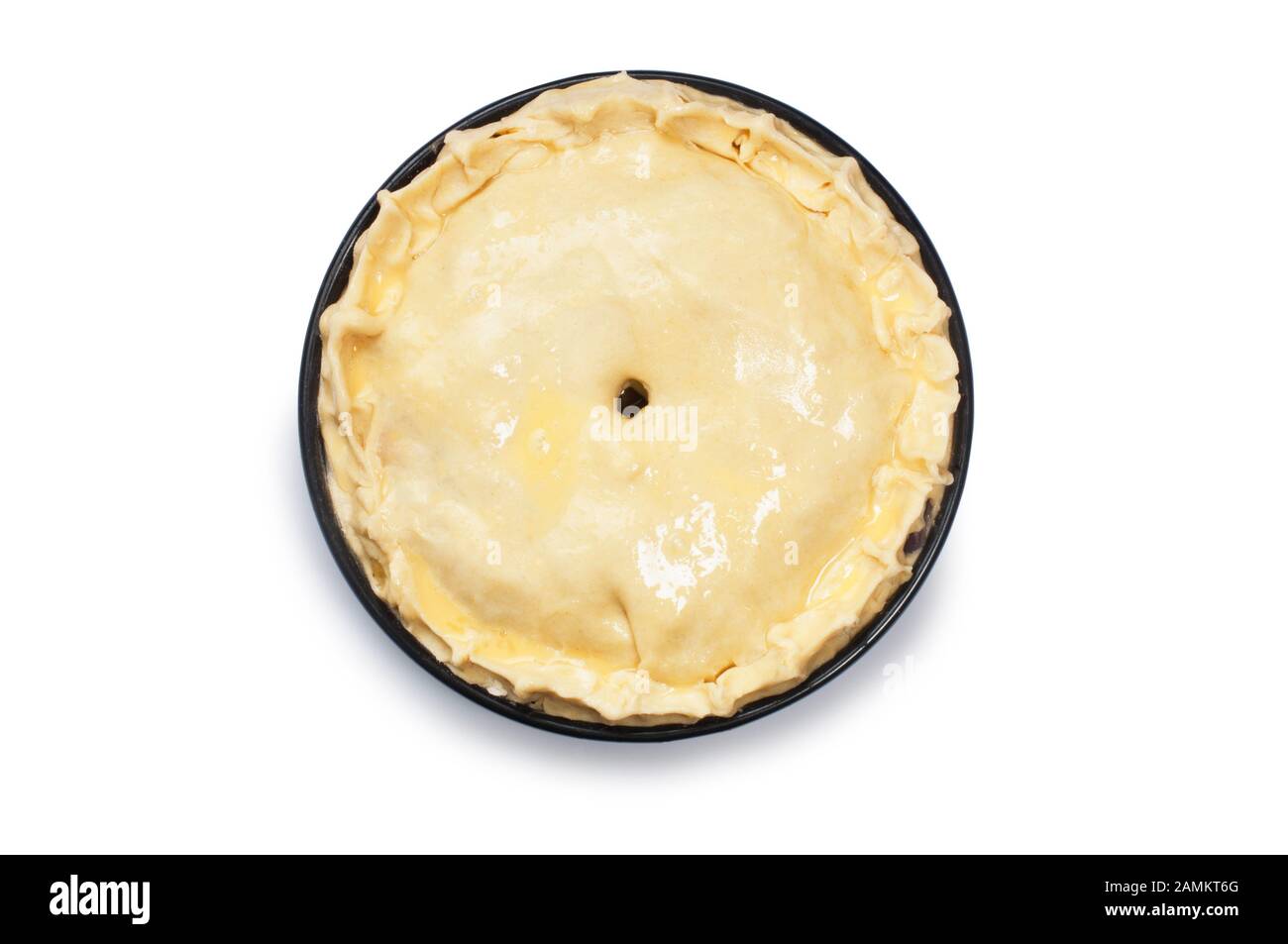 Studio shot of an uncooked pie cut out against a white background ...