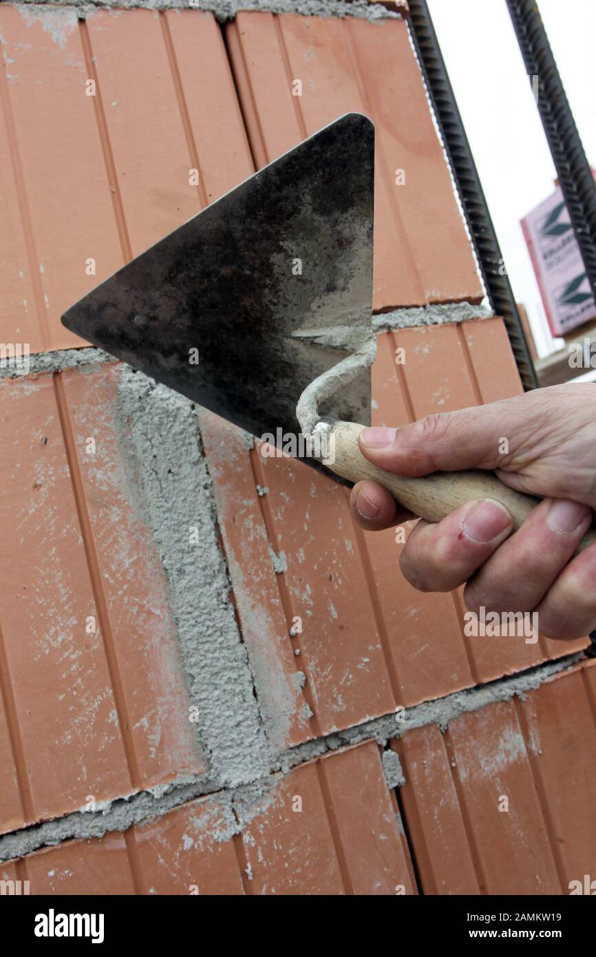 Portrait Bricklayer Nitsche Grouting with a trowel [automated ...