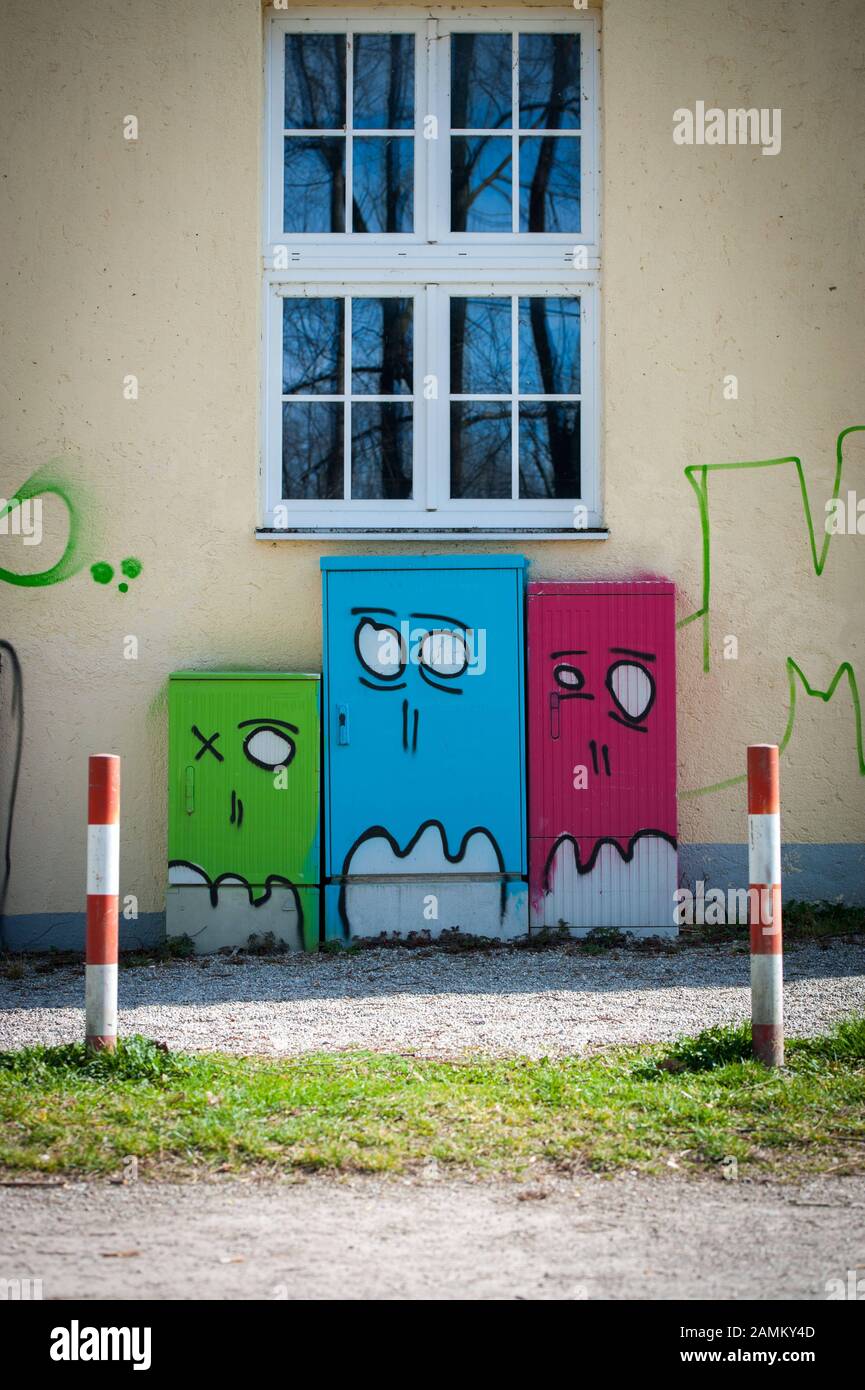 Power distribution boxes with face graffiti in Thalkirchen near ...
