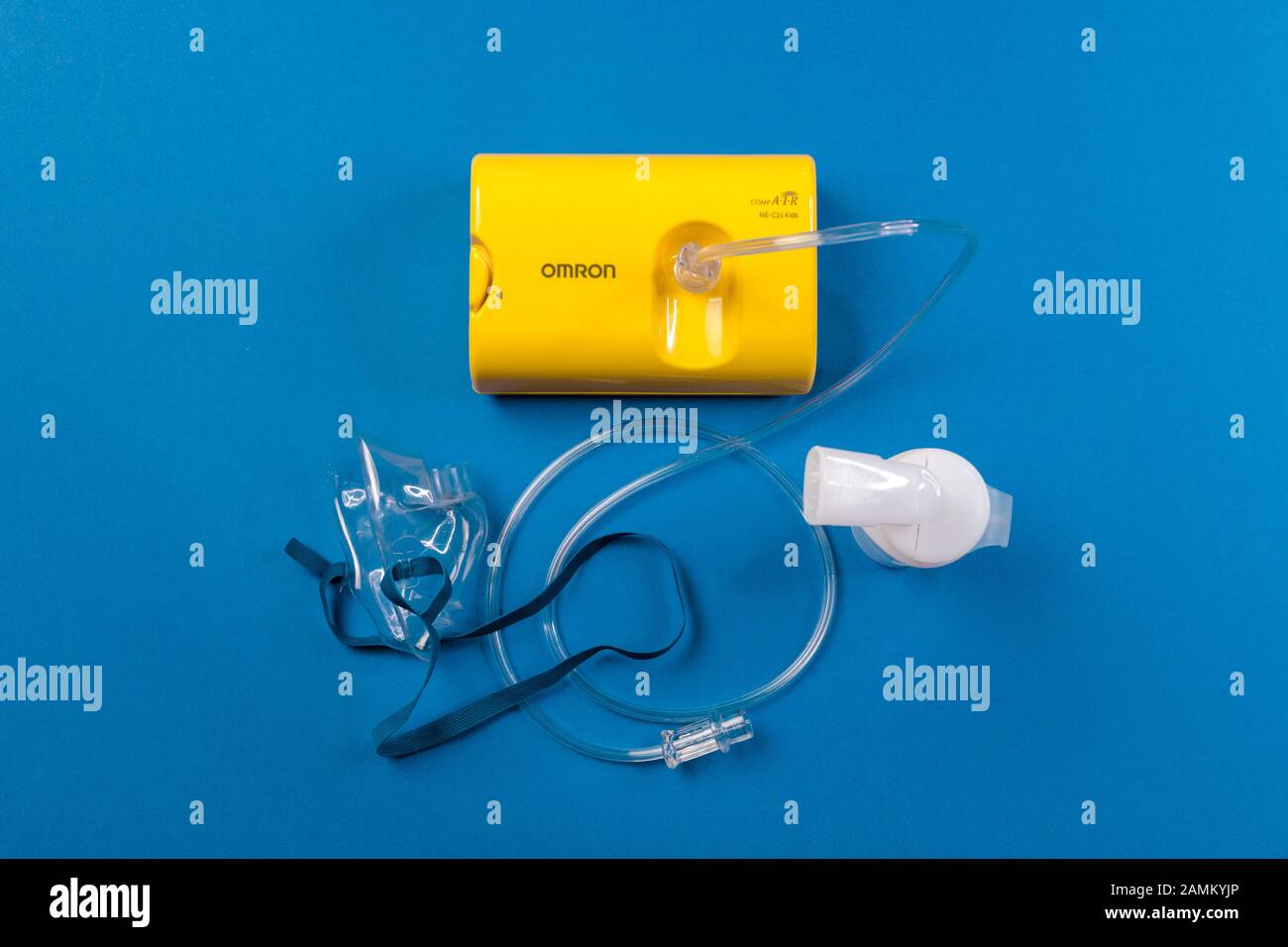 tube mask nebulizer and tubular transparent cable on blue background ...