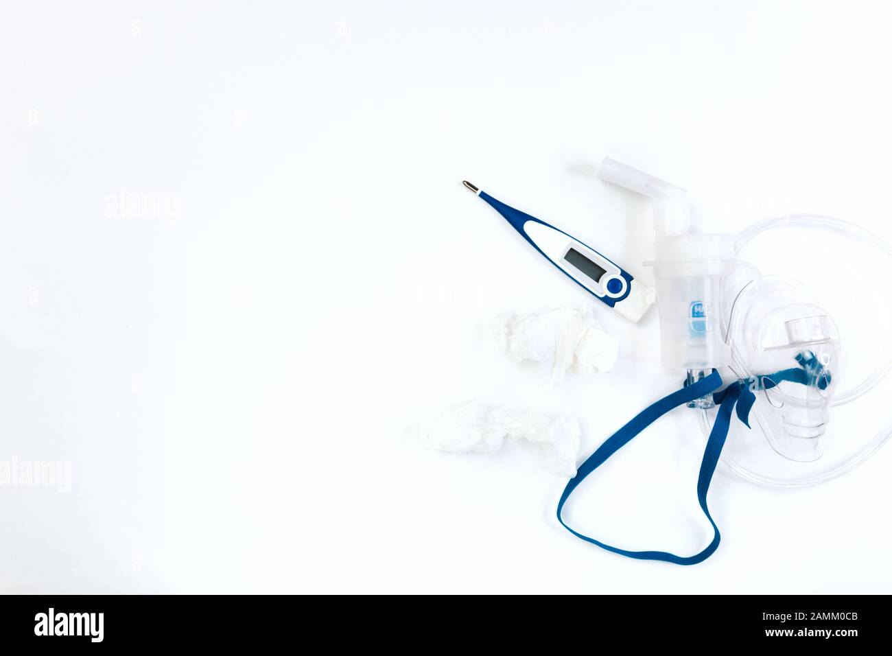 tube mask nebulizer and tubular transparent cable, thermometer on white ...