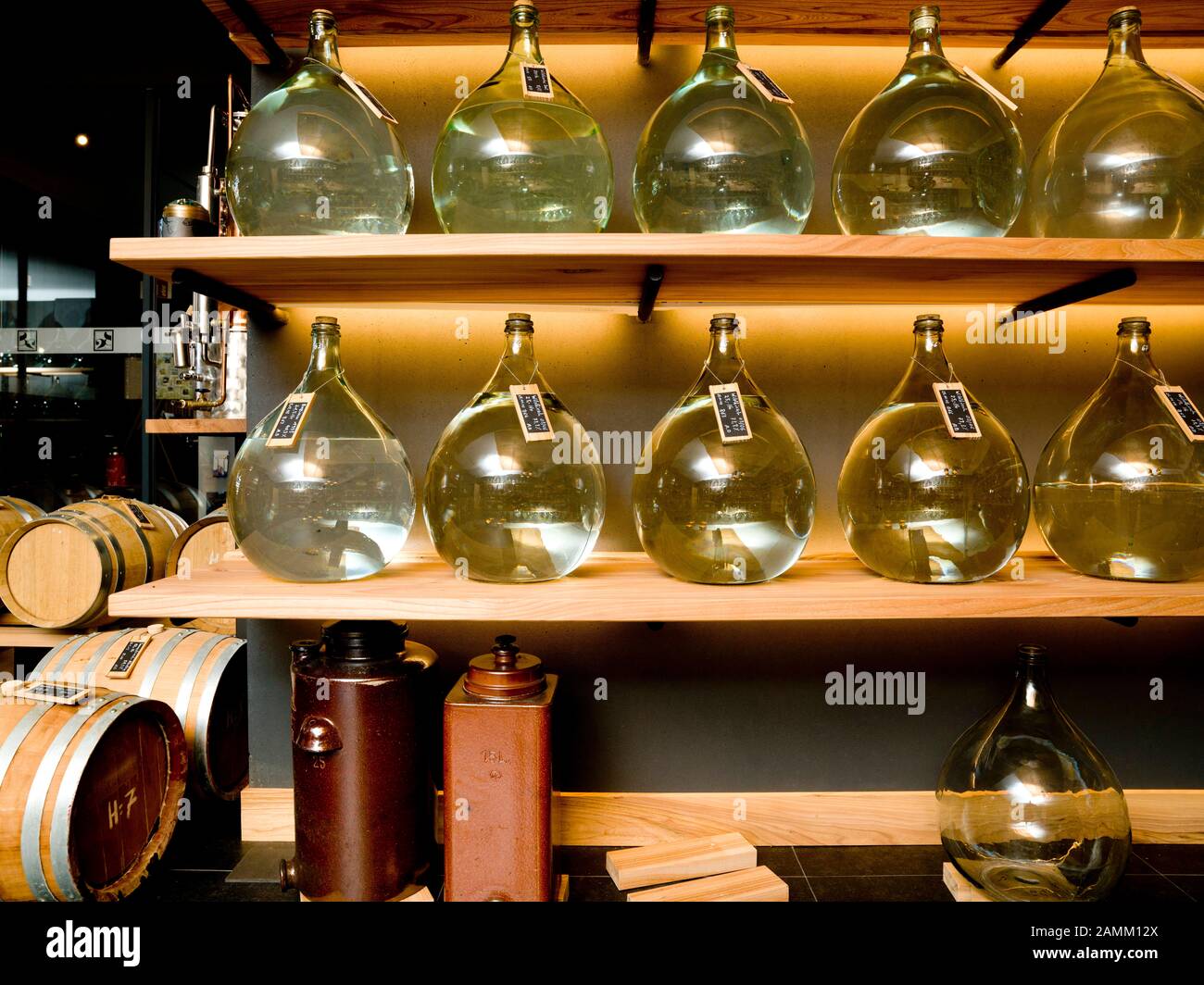 Schnapps bottles in the noble distillery Lantenhammer. [automated ...