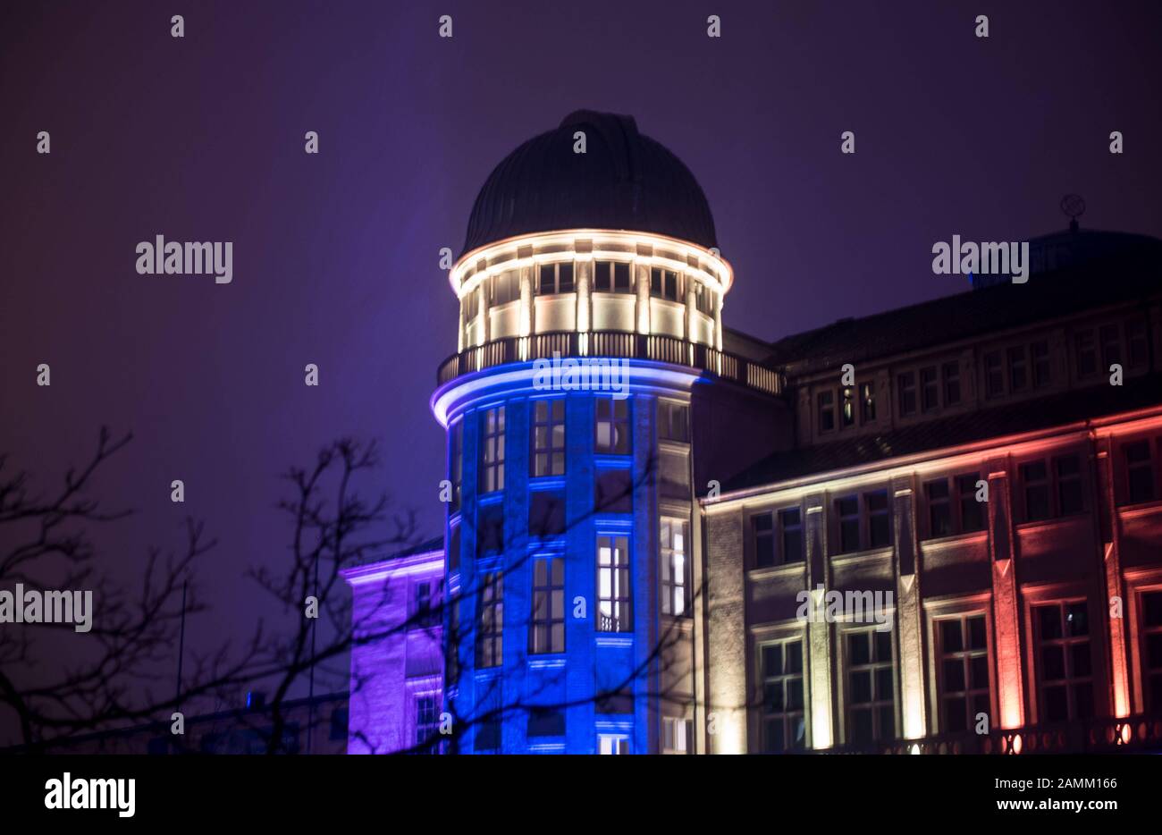 The façade of the Deutsches Museum shines in colourful illumination on ...