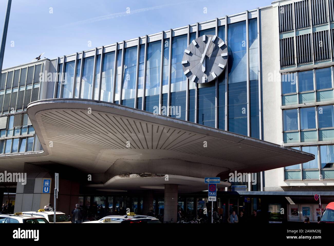 Main entrance of Munich central station with large clock. [automated ...