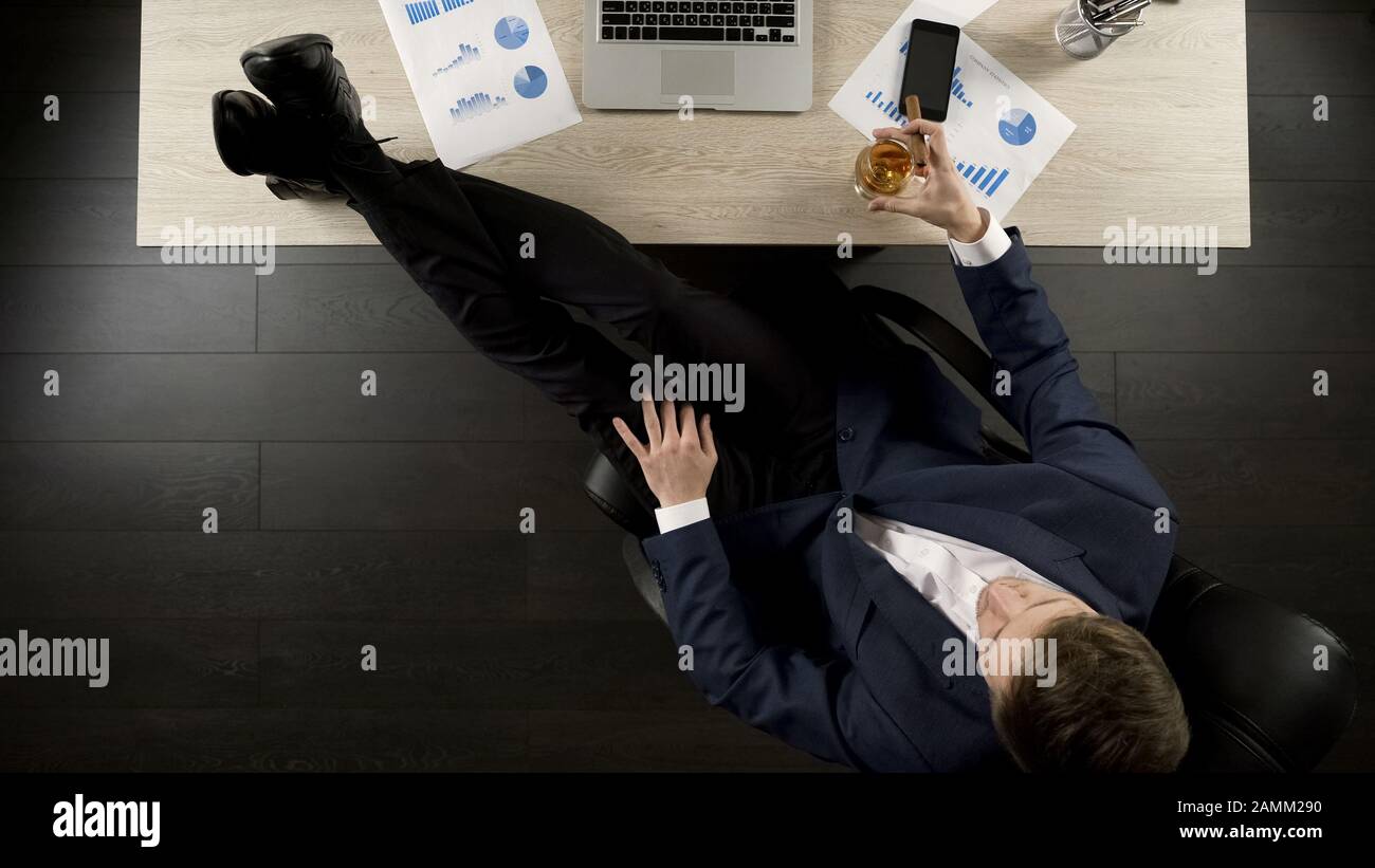 Rich businessman celebrating contract success with expensive alcohol ...