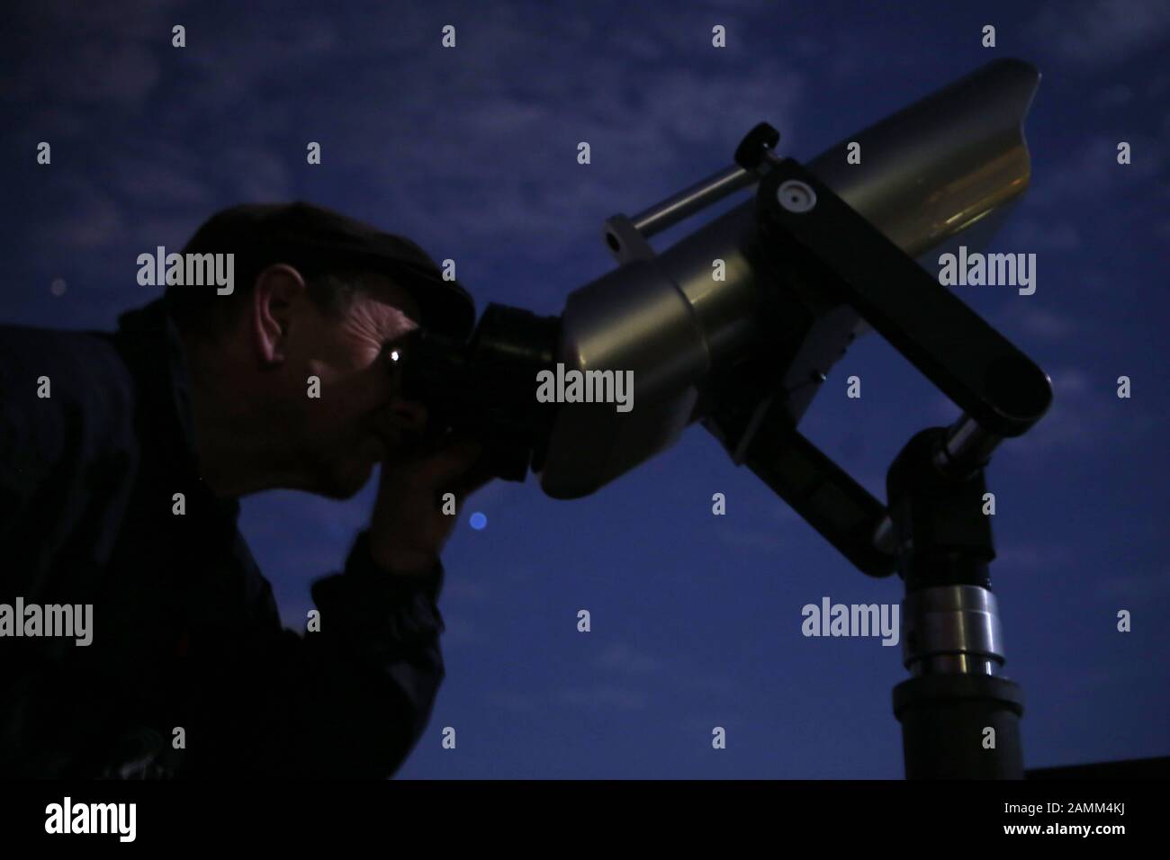 Visitors observe the total lunar eclipse over the city on the ...