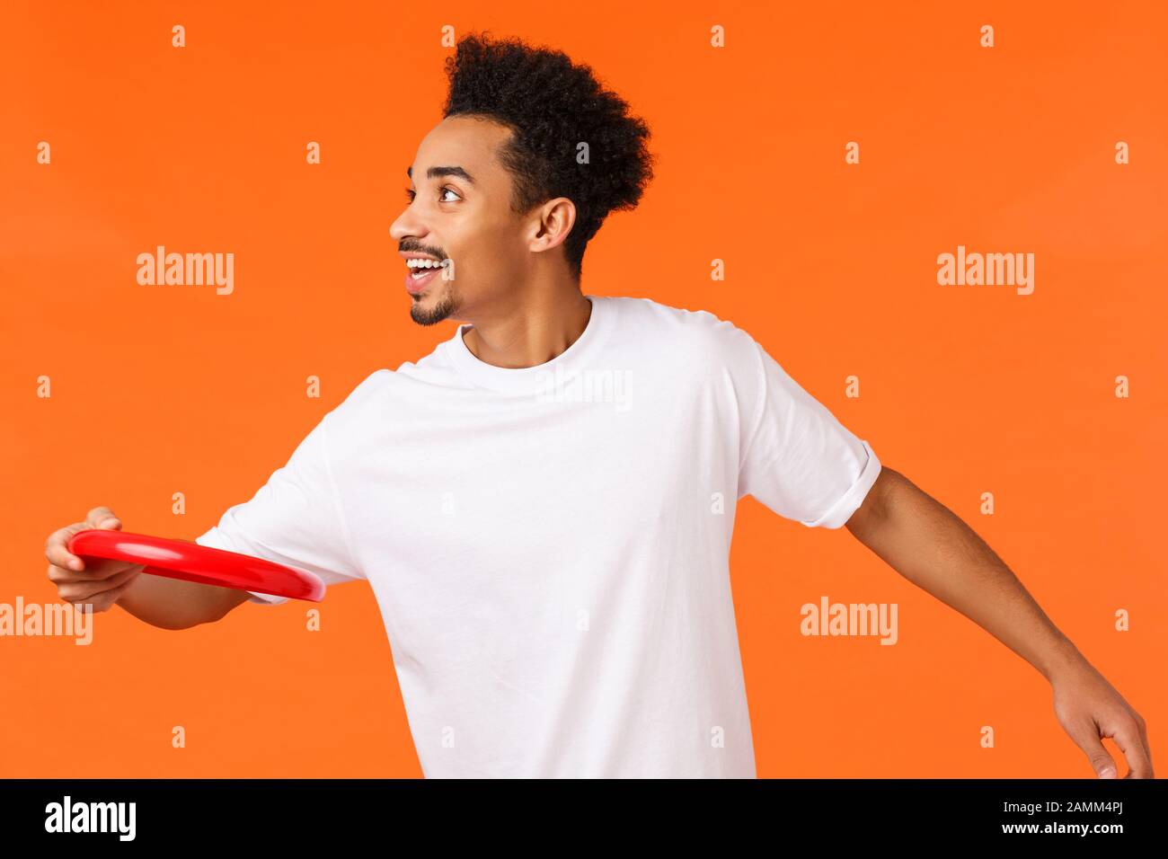 Happy, joyful charismatic african-american man playing with friends ...