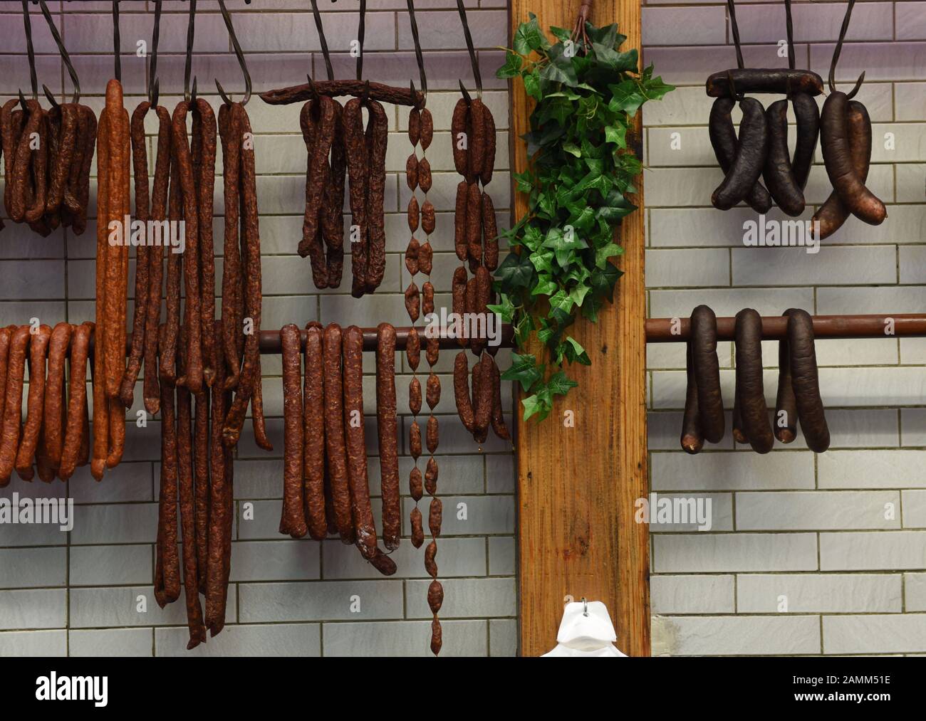 Sausages in a shop in the butcher's shop at the Viktualienmarkt in ...