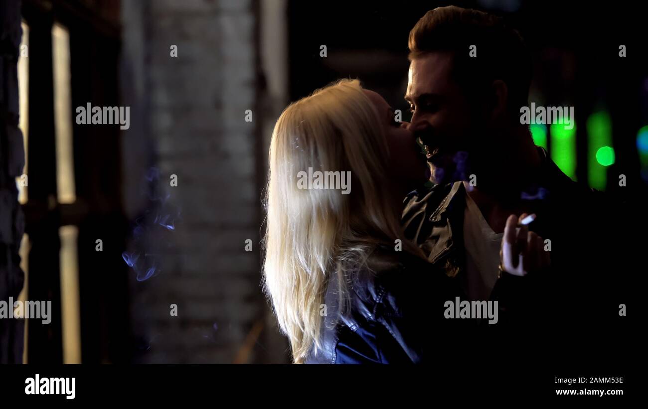 Handsome man and woman laughing, flirting, passionate embraces before ...