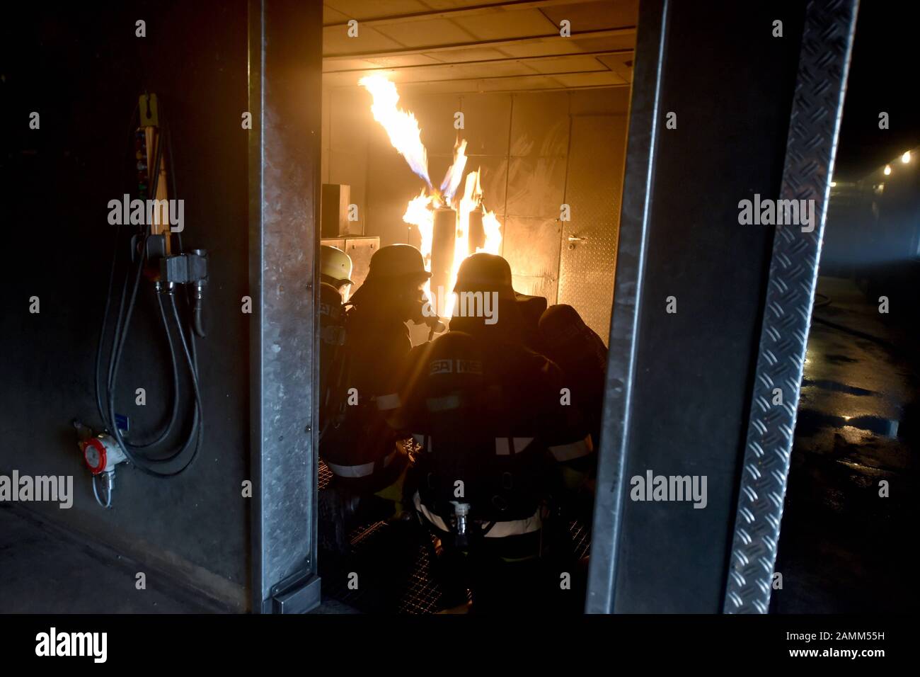Fire brigade students during a training mission in a fire simulation ...