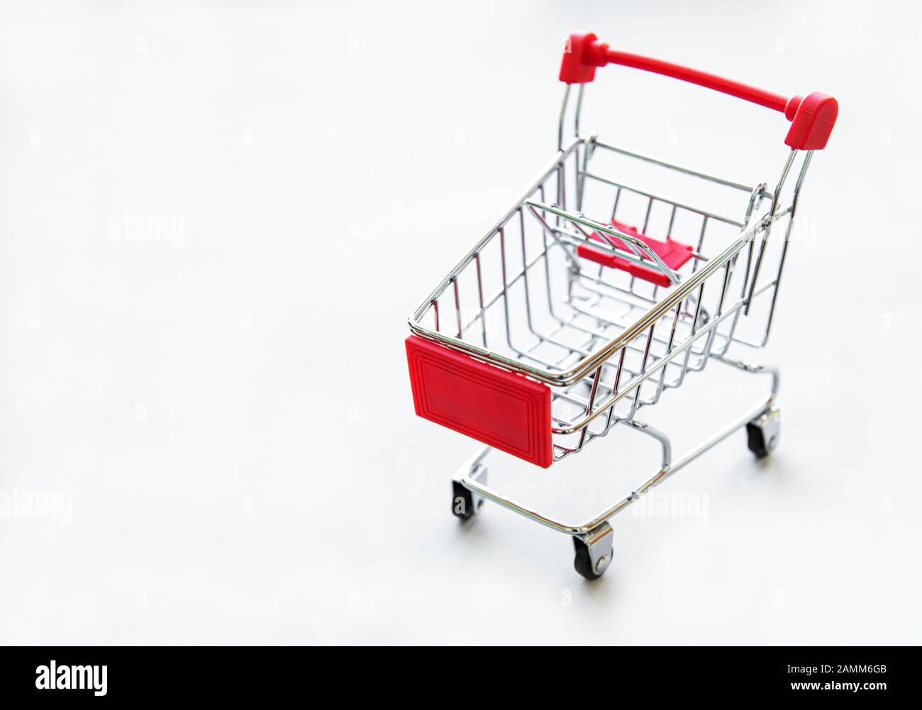 Small supermarket grocery push cart for shopping on white background ...