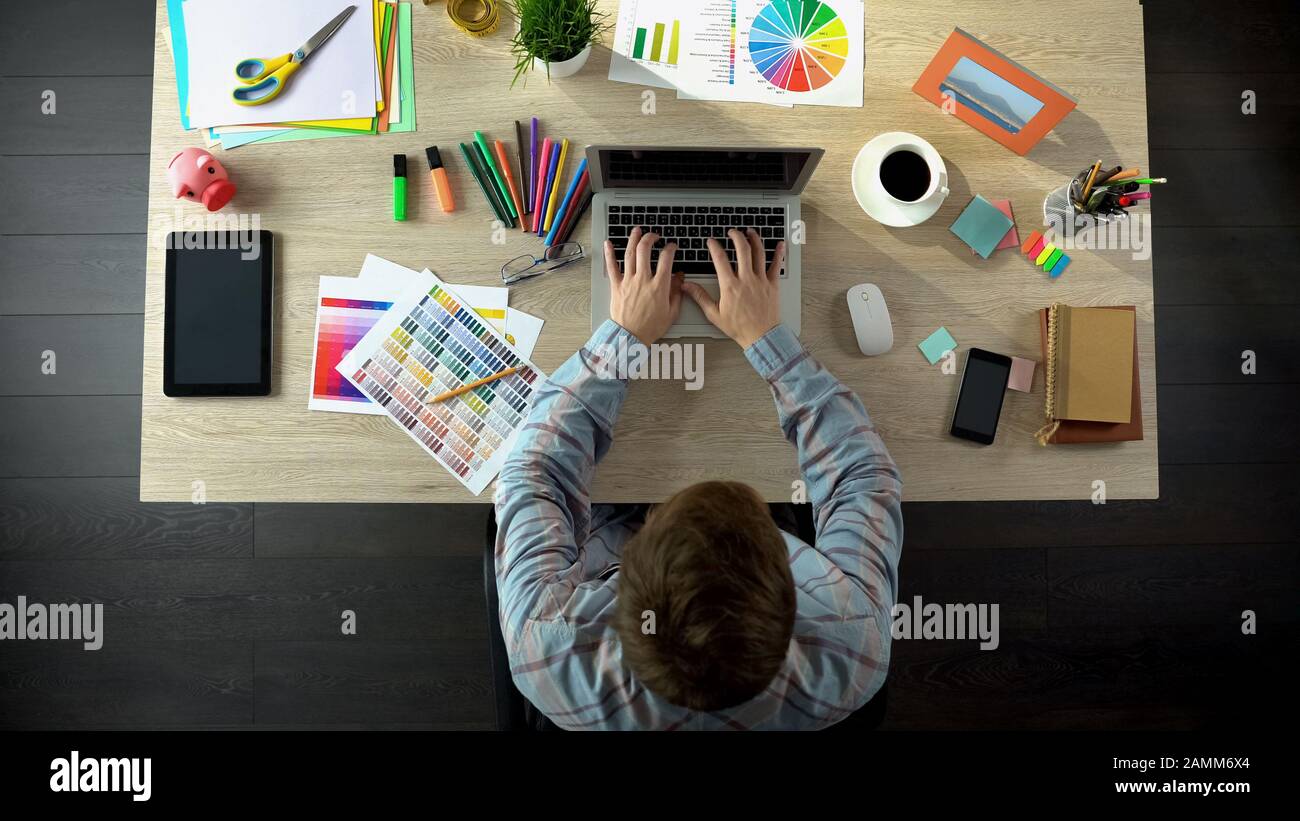 Designer helping client choose color hi-res stock photography and ...