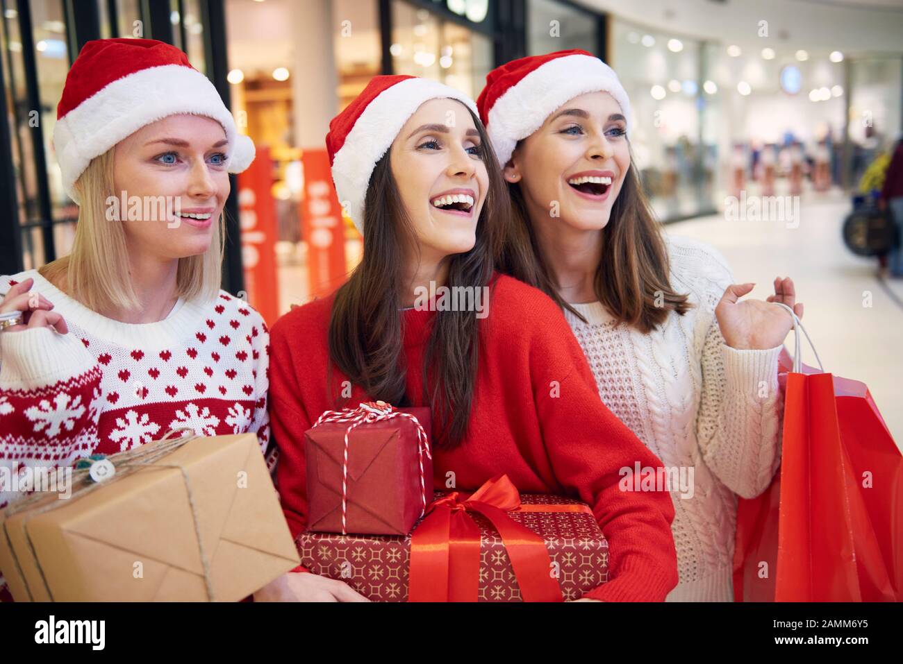Christmas surprise with three friends hi-res stock photography and ...