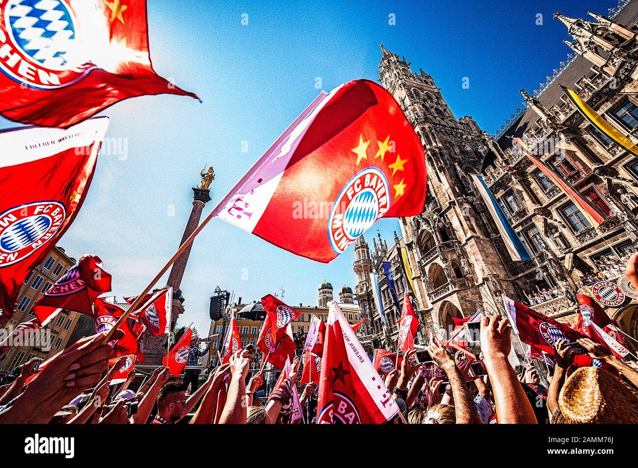 Cheering fans of FC Bayern Munich on Munich's Marienplatz [automated ...