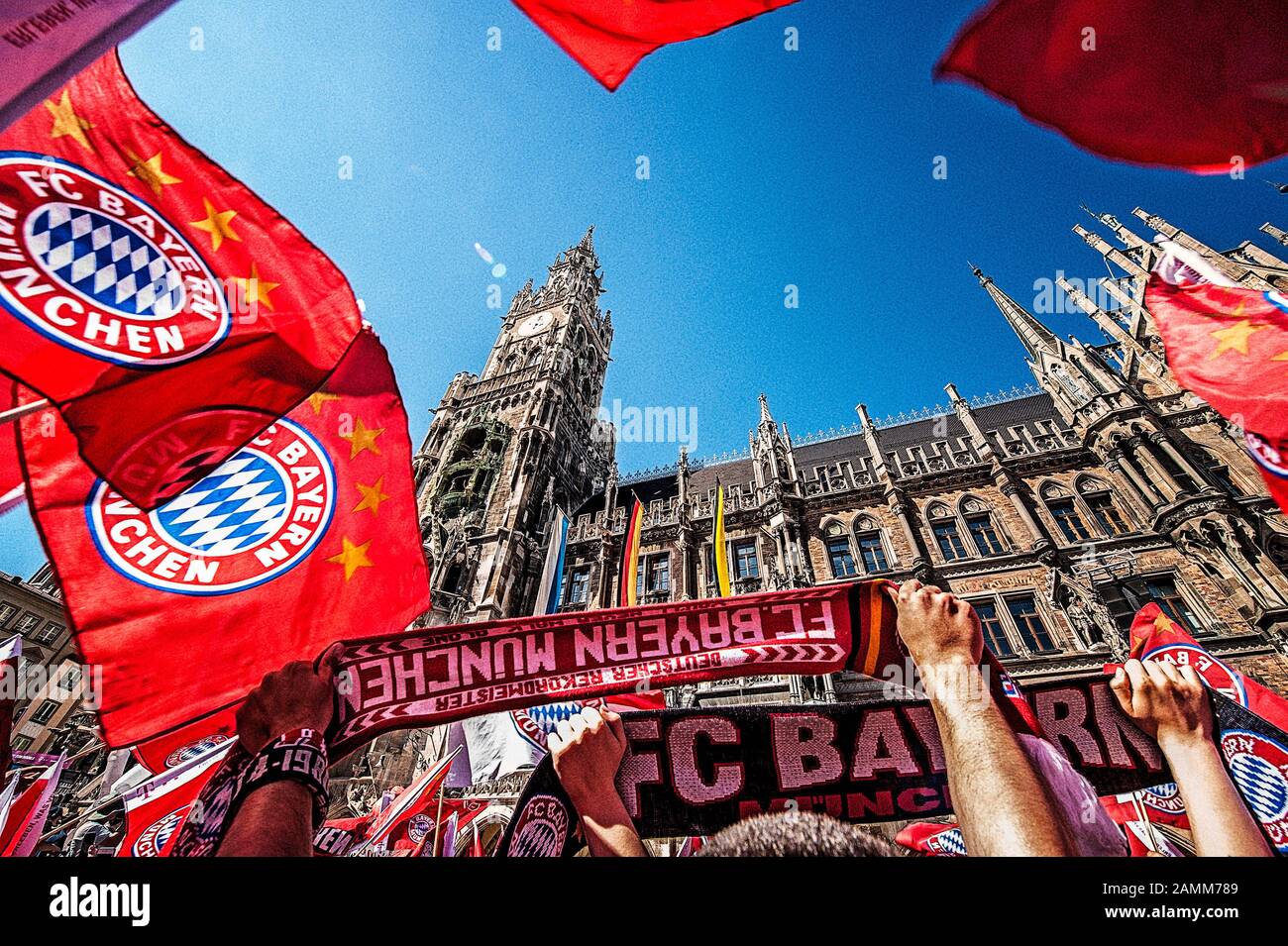 Cheering fans of FC Bayern Munich on Munich's Marienplatz [automated ...