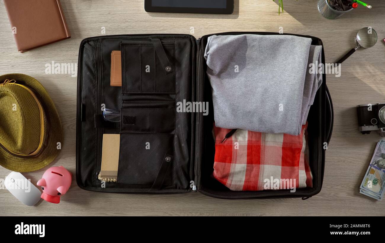 Things packed in suitcase on table, summer vacation, business trip, top ...