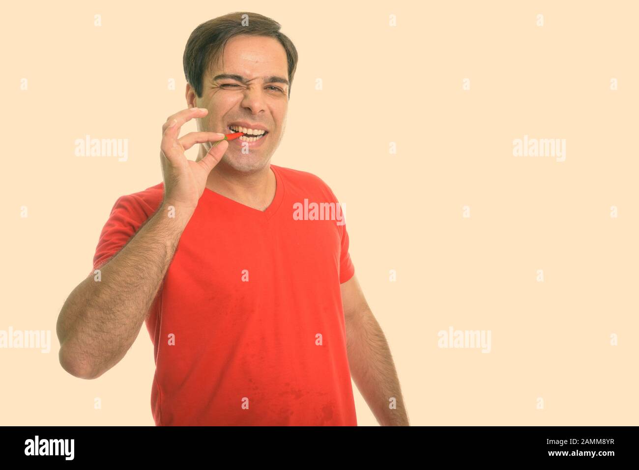 Man eating chili pepper hi-res stock photography and images - Alamy