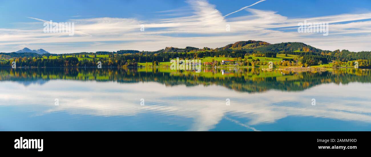 Panoramic landscape in Bavaria with Forggensee and mountains in the ...