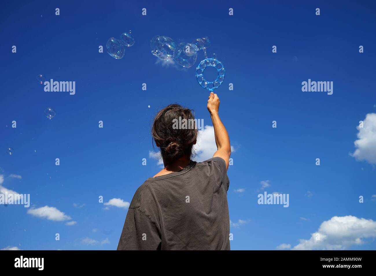 Participant in a soap bubble competition in the open-air cinema in the ...