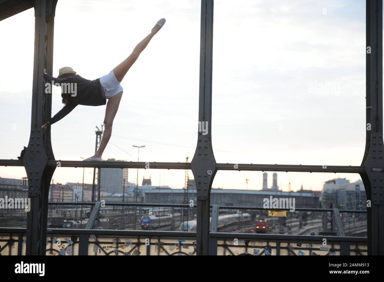 An American tourist doing gymnastic exercises in the arches of the ...