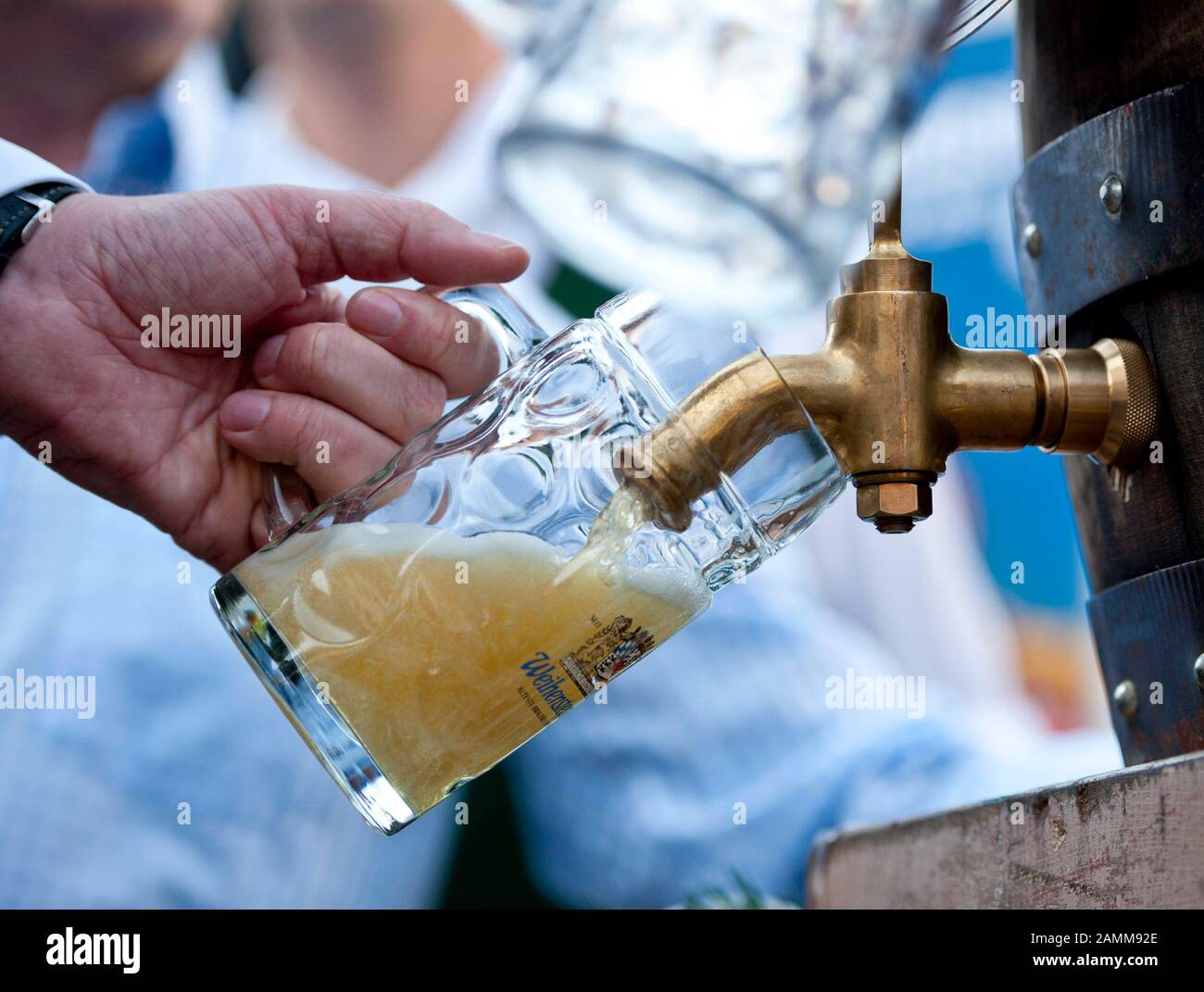 Mayor Tobias Eschenbacher pours Weihenstephan beer from a barrel at the ...