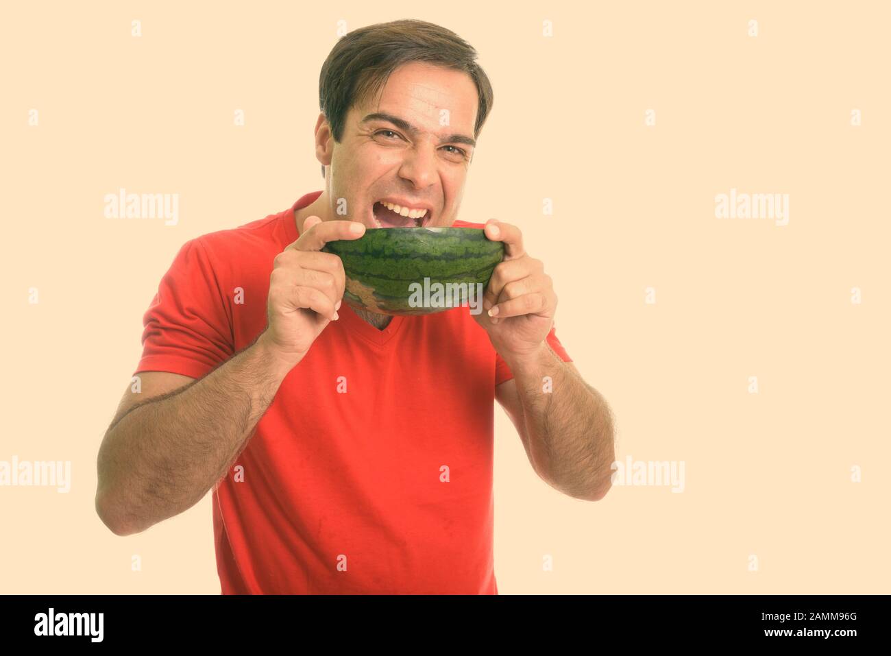 Happy man eating fruit hi-res stock photography and images - Alamy
