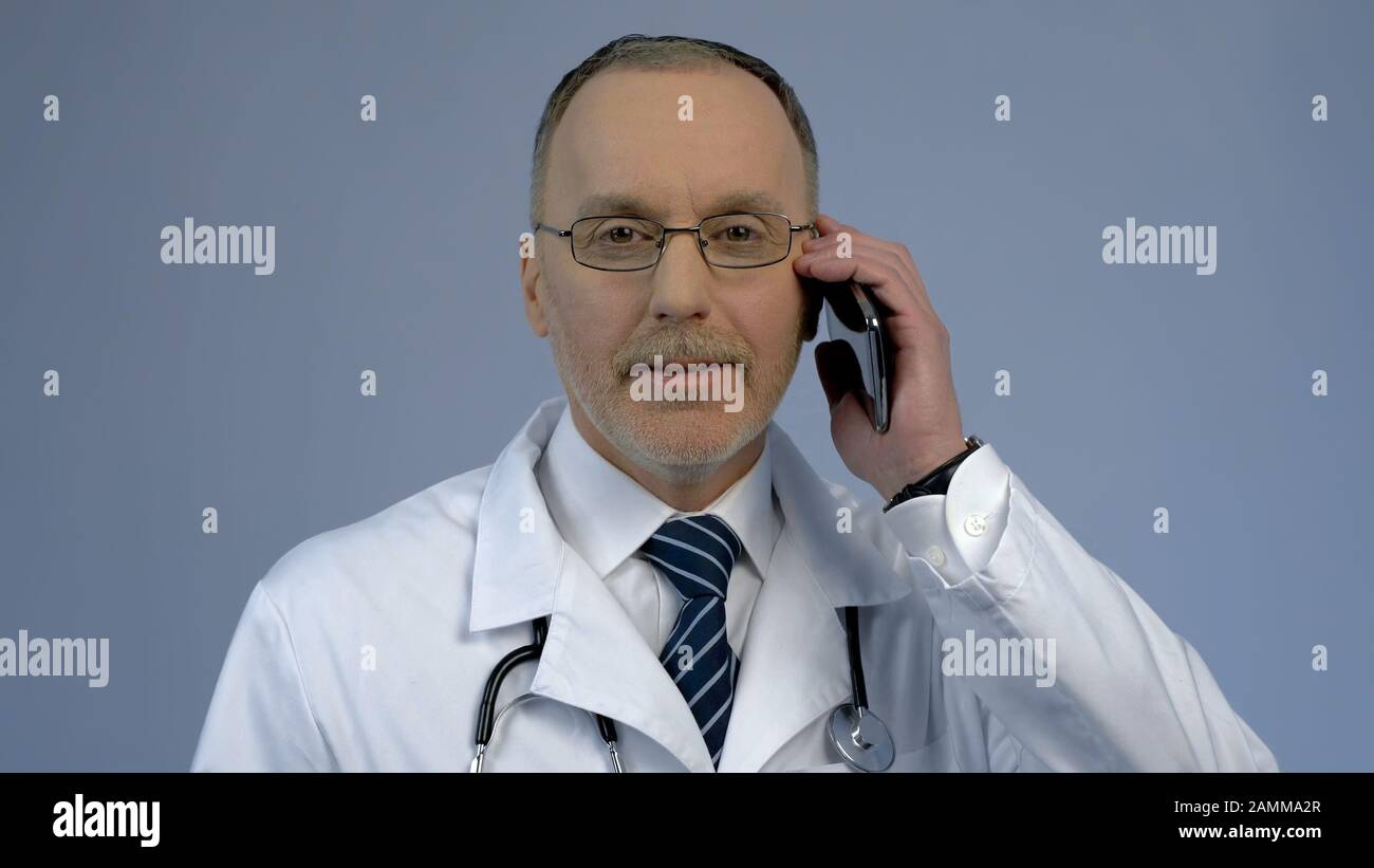 Doctor calling patient hi-res stock photography and images - Alamy