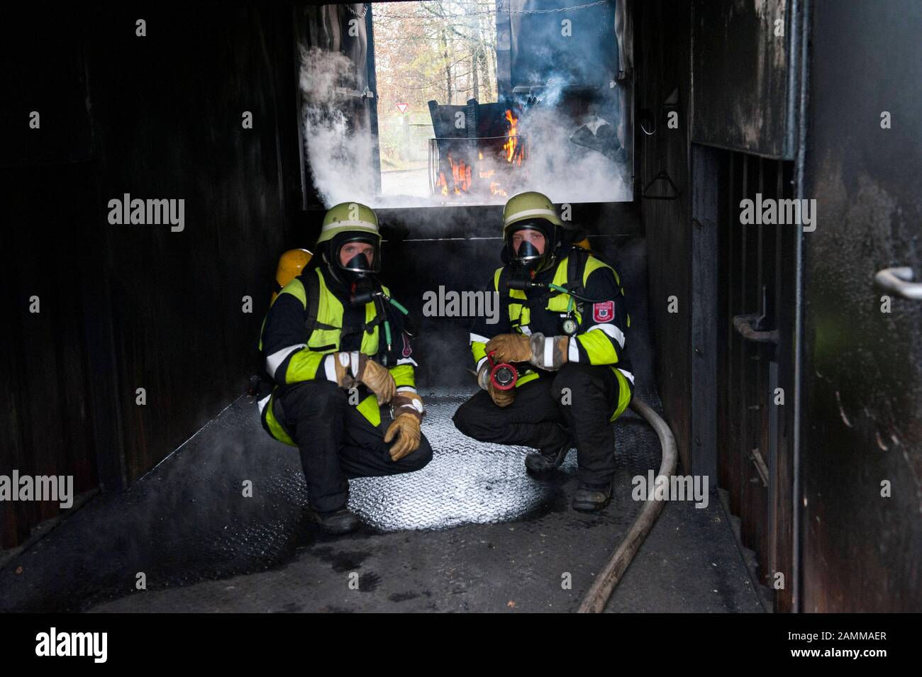 Training in a wood-fired fire training container Respirator training ...