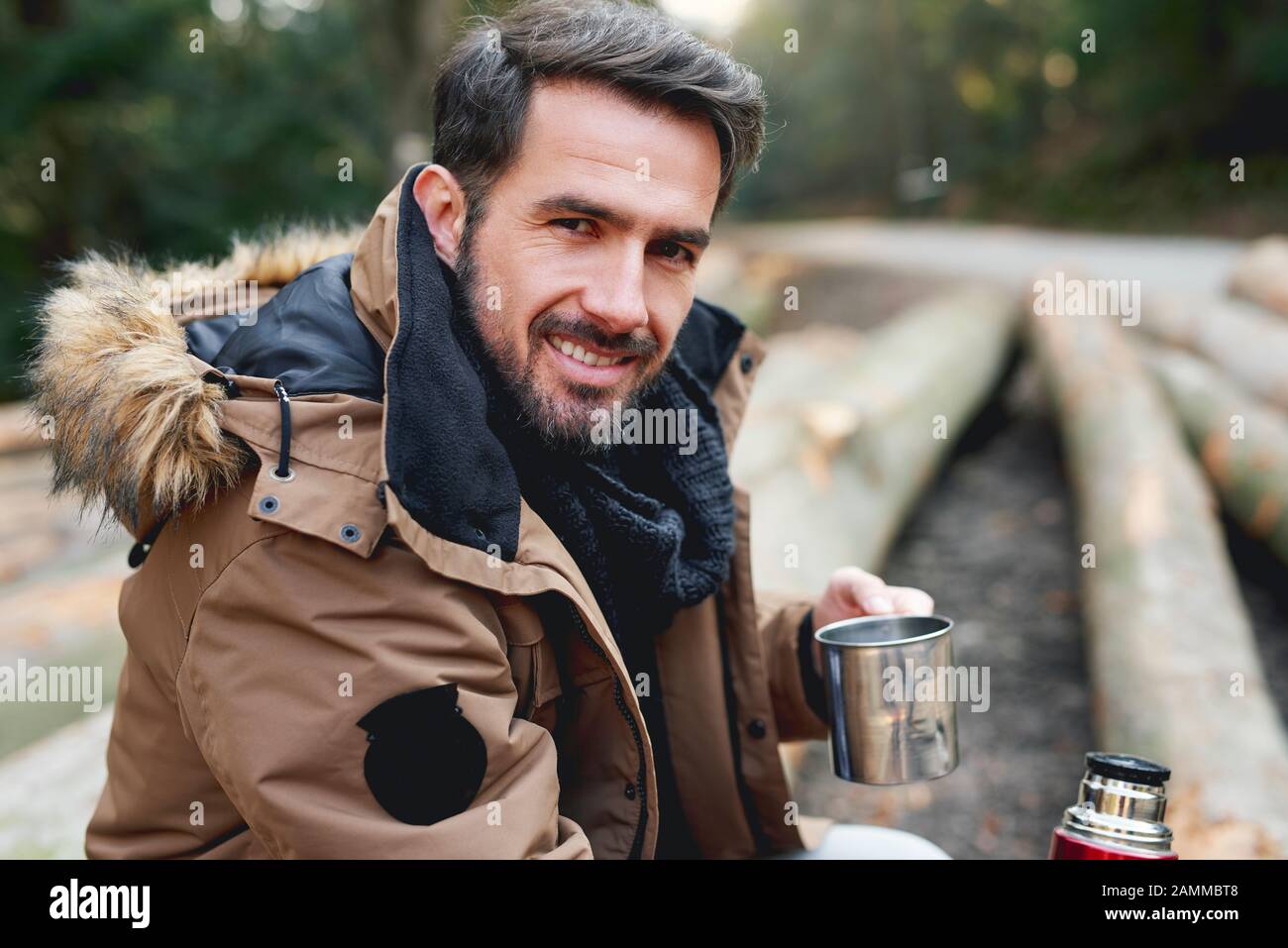 Portrait of handsome man in forest in wintertime Stock Photo - Alamy