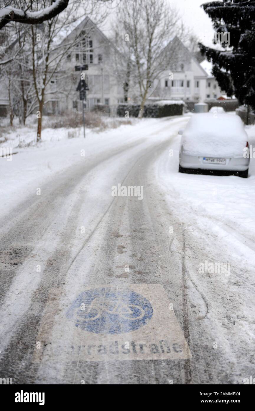 An uncleared, snow-covered bicycle path in Munich. [automated ...