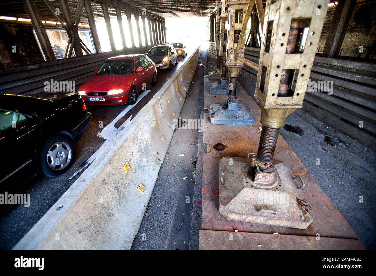 Temporary supporting pillars secure the dilapidated railway bridge in ...
