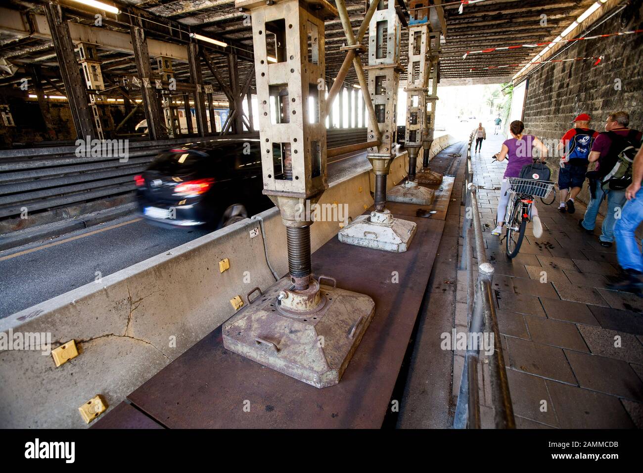 Temporary supporting pillars secure the dilapidated railway bridge in ...