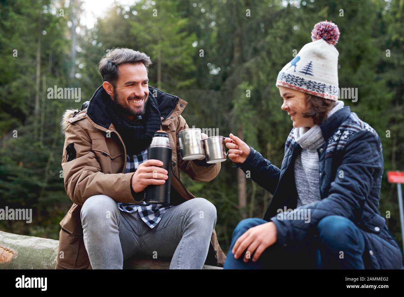 Father and son making a toast in the forest Stock Photo - Alamy