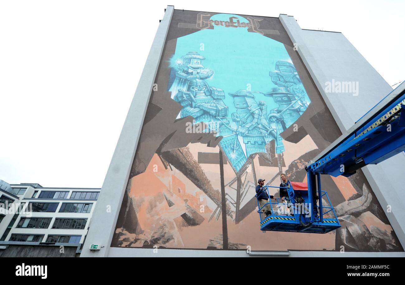 22-metre-high graffito by street artists Loomit (left) and WonABC on a ...