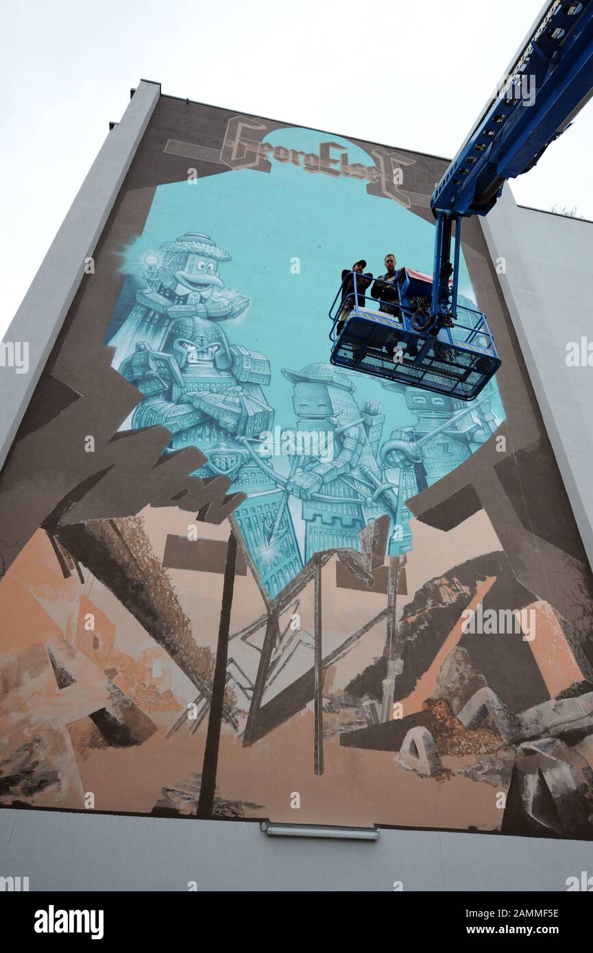 22-metre-high graffito by street artists Loomit (left) and WonABC on a ...