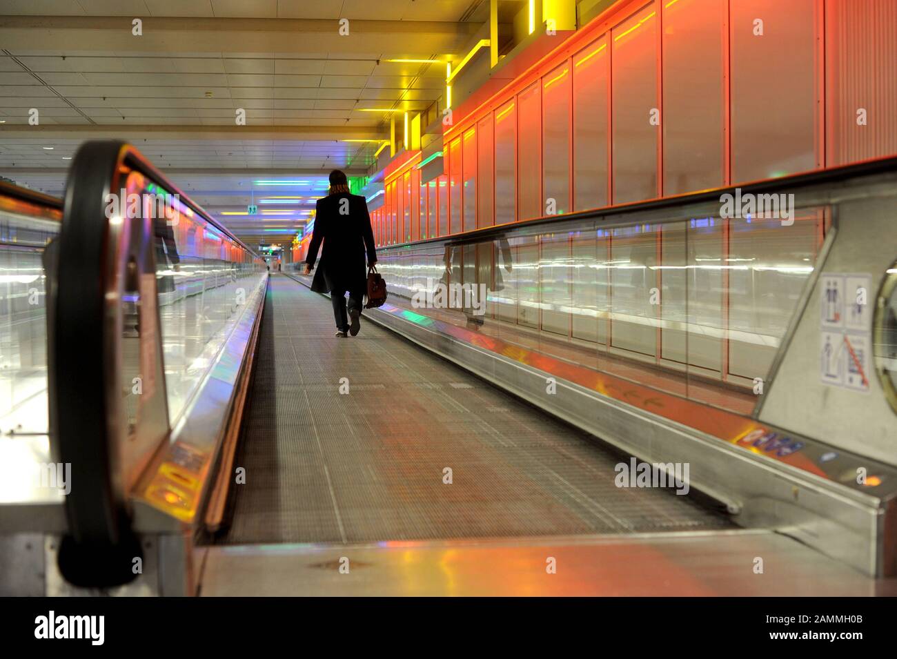 Passengers travelling by air on a moving walkway under Terminal 1 at ...