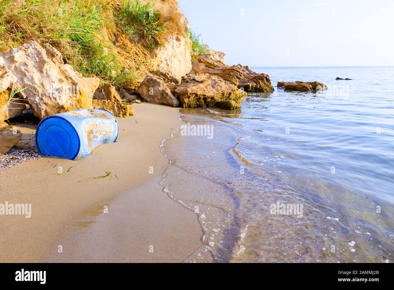 Used blue plastic drums for storing water and other liquids is washed ...