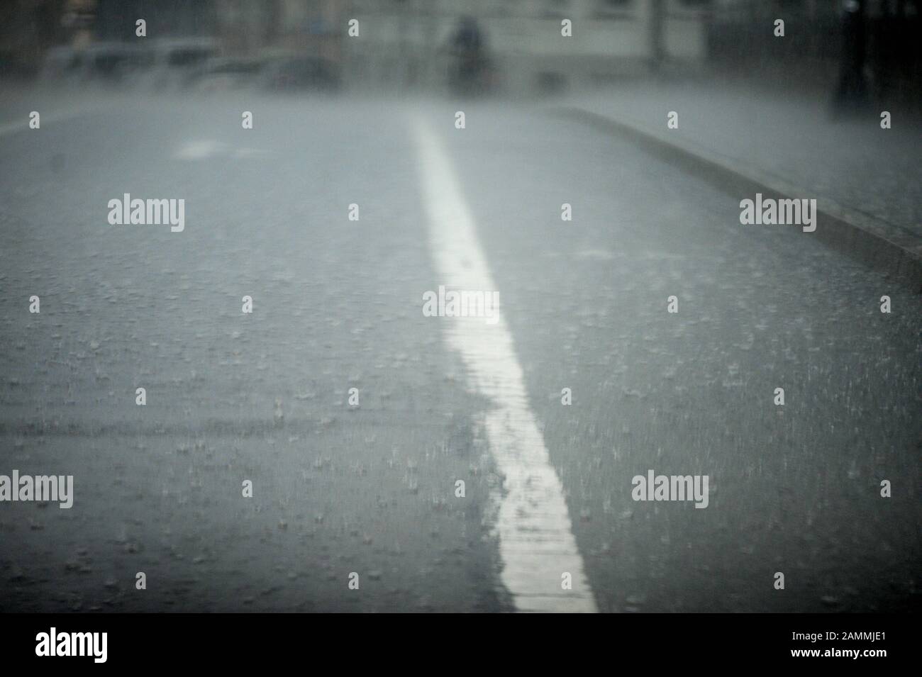 Street in heavy rain in Munich. [automated translation] Stock Photo - Alamy