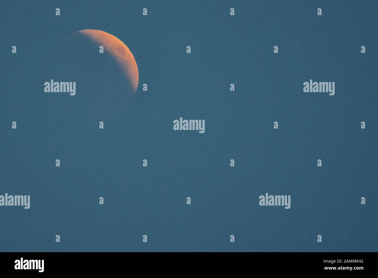 Full moon during a total shadow eclipse over Munich. The moon enters ...