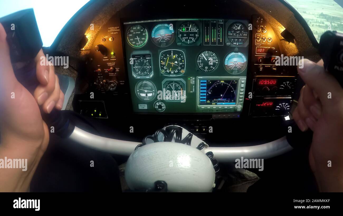 Male hands controlling flight simulator, beginner pilot practicing at ...