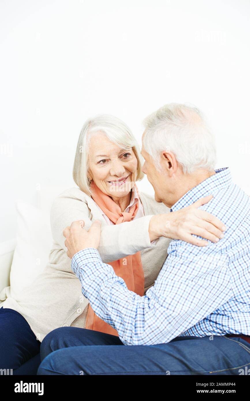 Senior couple seniors happily hugging in nursing home Stock Photo - Alamy