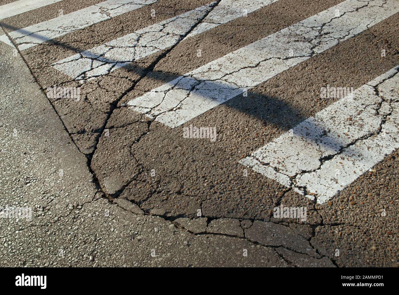Pedestrian Crossing on Cracked Road, Seville, Spain Stock Photo - Alamy