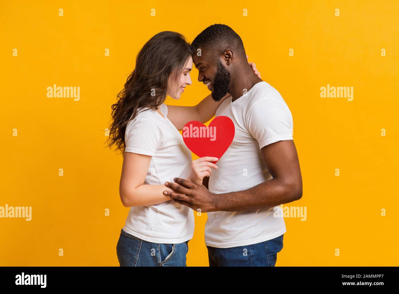 Young Couple Embracing Touching Foreheads High Resolution Stock ...