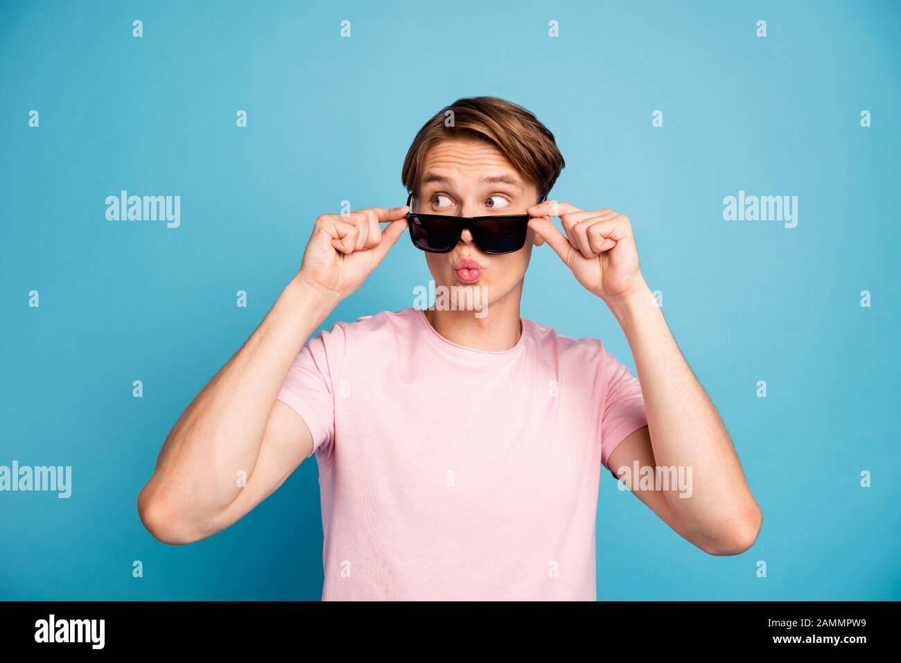 Portrait of amazed imposing guy touch his specs look copy space feel ...