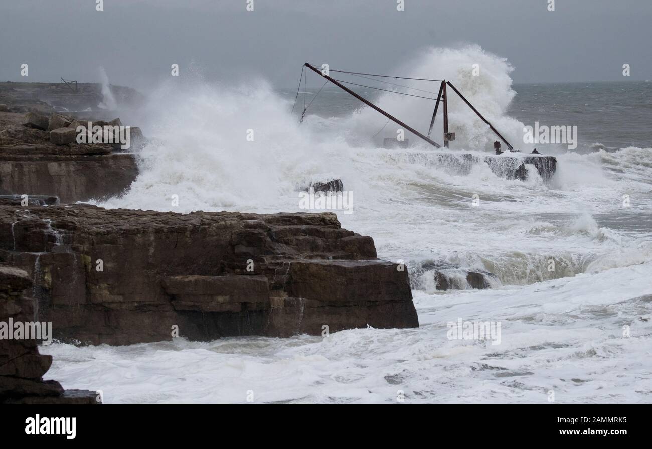 Waves crash against the shoreline at Portland Bill in Dorset Stock ...