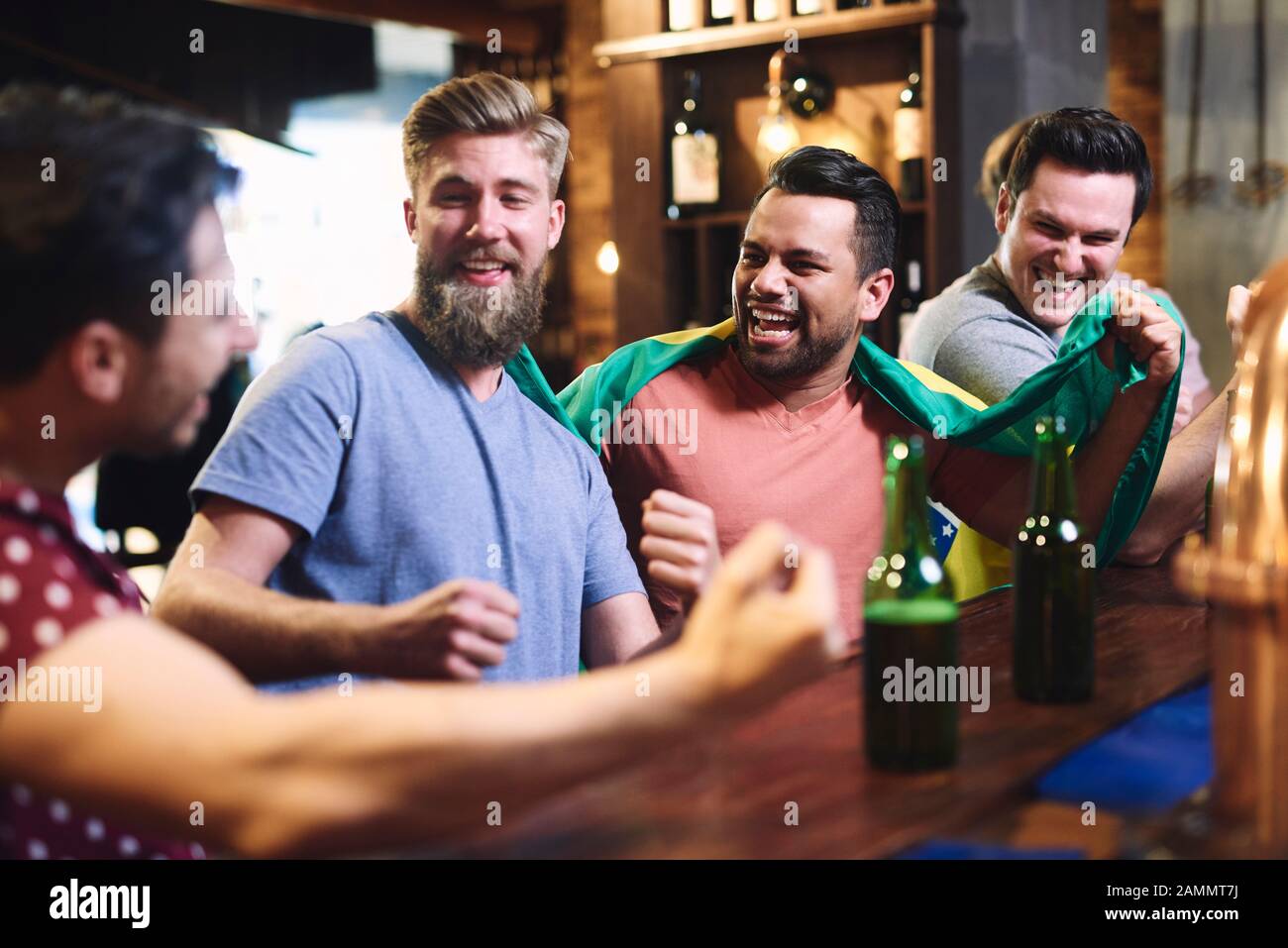 Three guys watching american football competition Stock Photo - Alamy