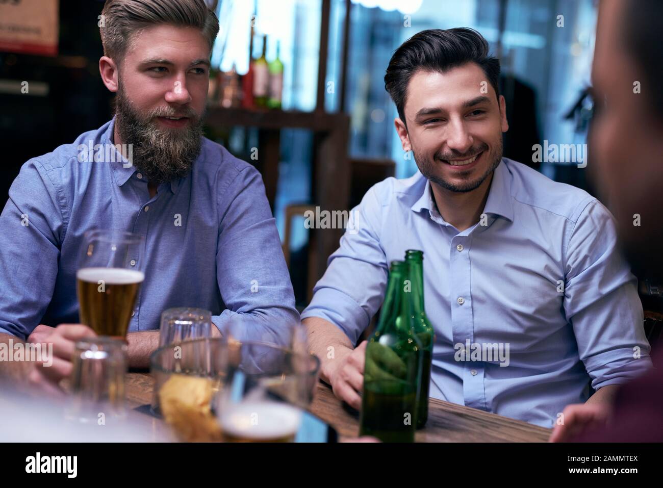 Two guys spending the weekend together in the pub Stock Photo - Alamy