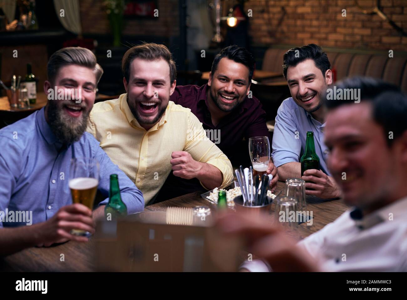 Meeting with group of friends in the pub Stock Photo - Alamy