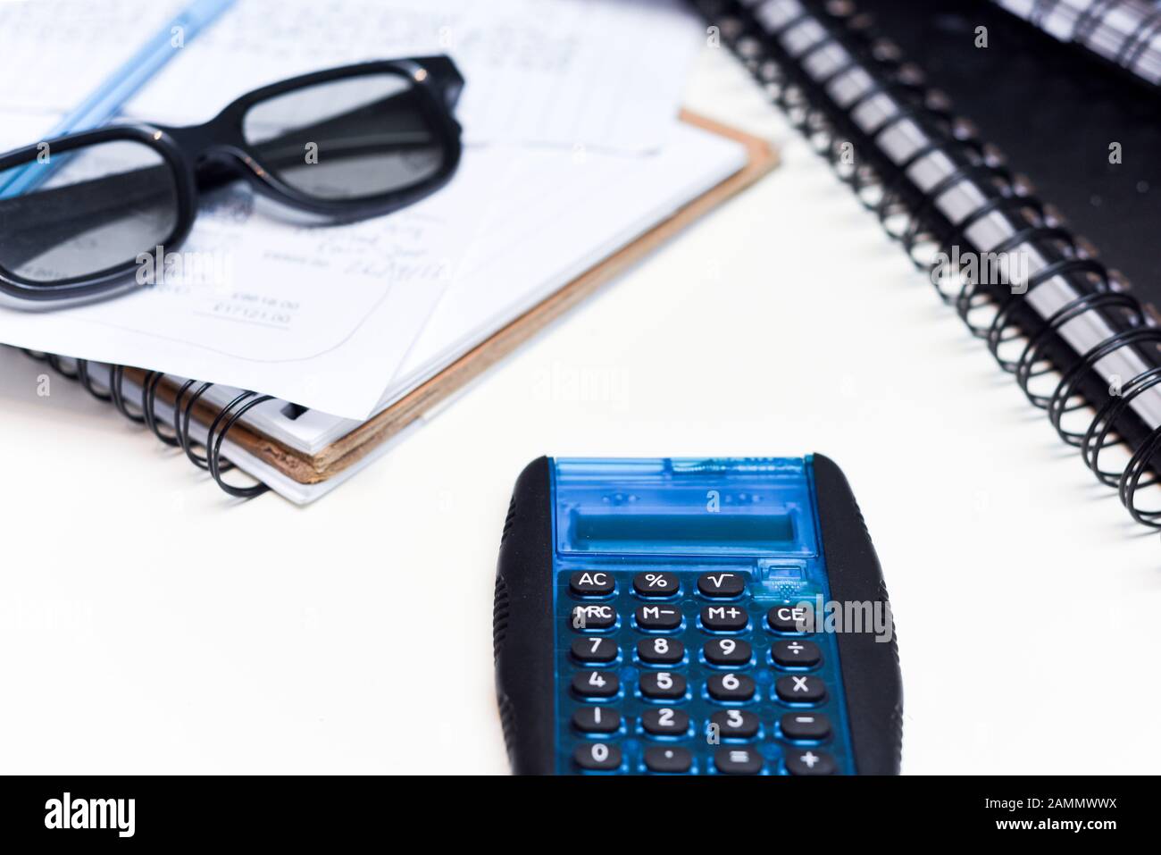 Calculating tax return numbers and figures on office desk concept for ...