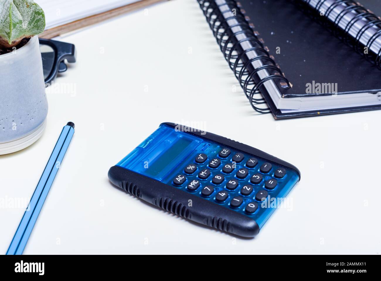 Calculating tax return numbers and figures on office desk concept for ...